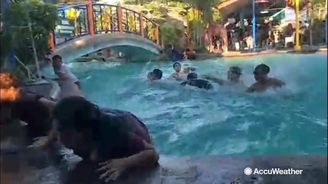 Earthquake causes chaos in swimming pool as kids frantically try to get ...