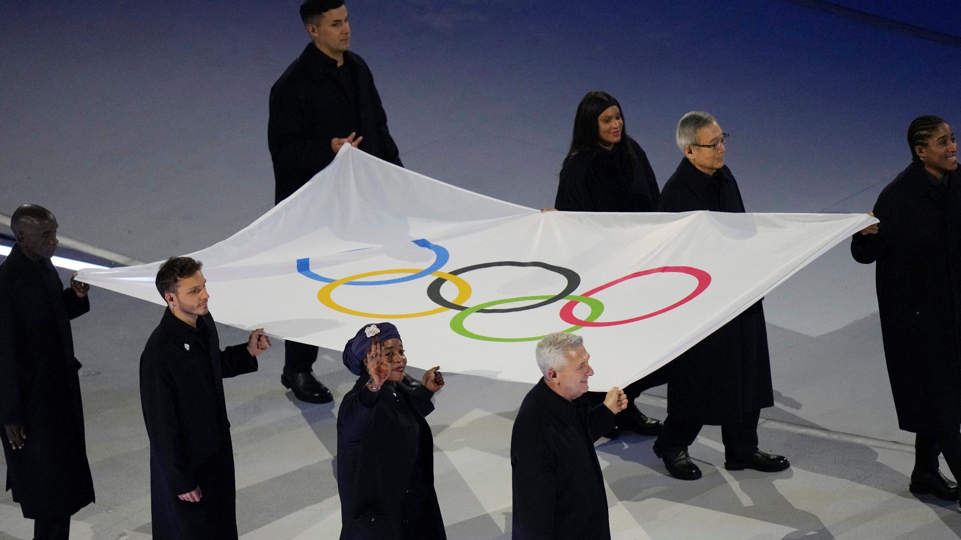 Tonga's viral shirtless flag bearer back for 2026 Opening Ceremony, but ...