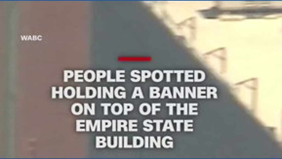People standing on the Empire State Building | 13newsnow.com
