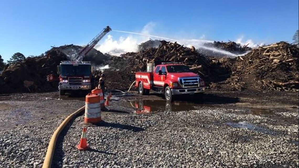 Firefighters work to extinguish large debris fire in Bowers Hill ...