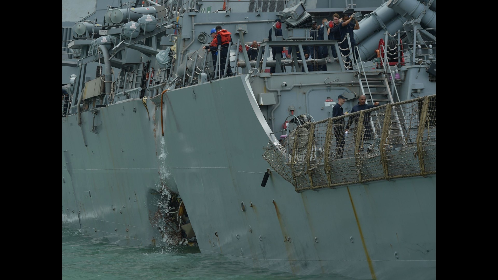 USS John S. McCain returns to the water following deadly collision ...