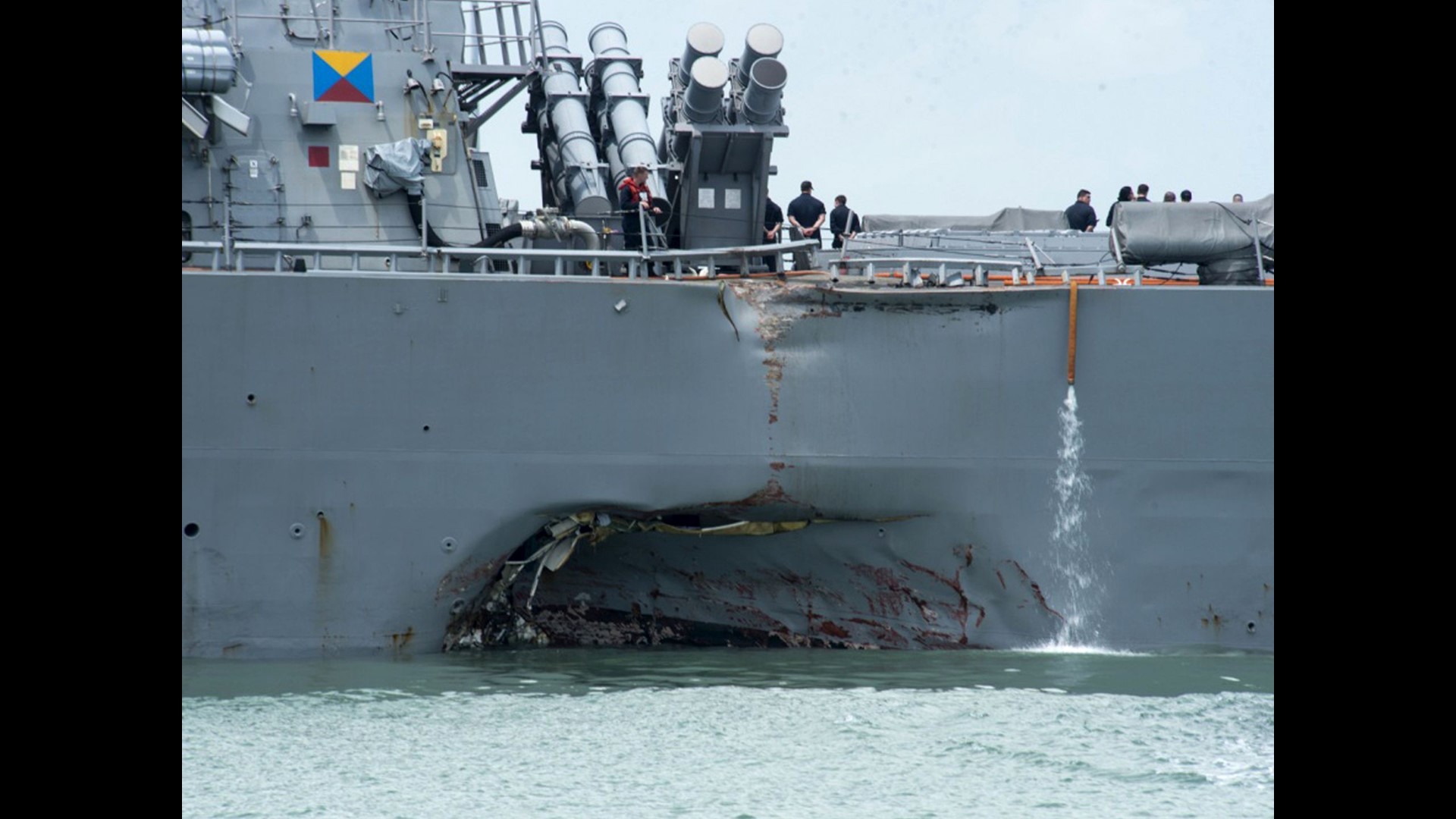 USS John S. McCain returns to the water following deadly collision ...