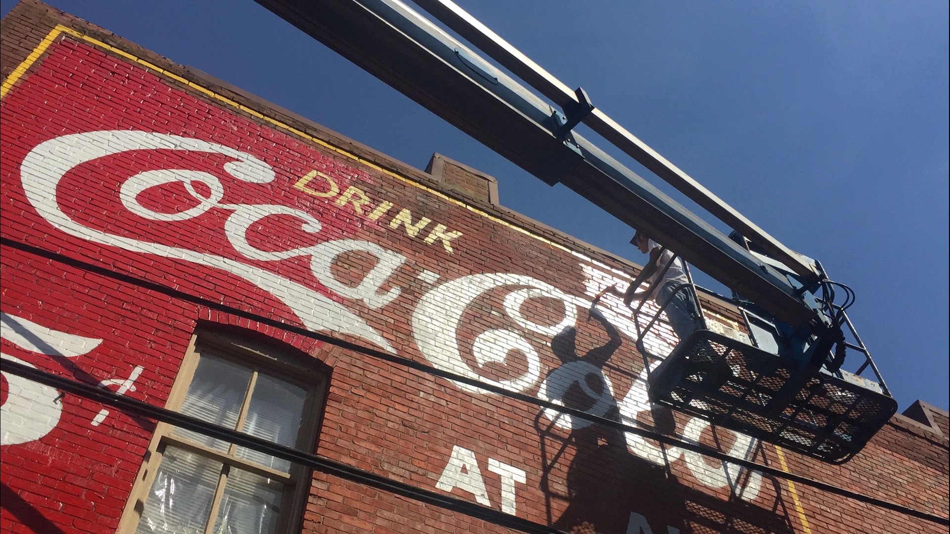 Vintage Coca-Cola sign restored on Parksley building | 13newsnow.com