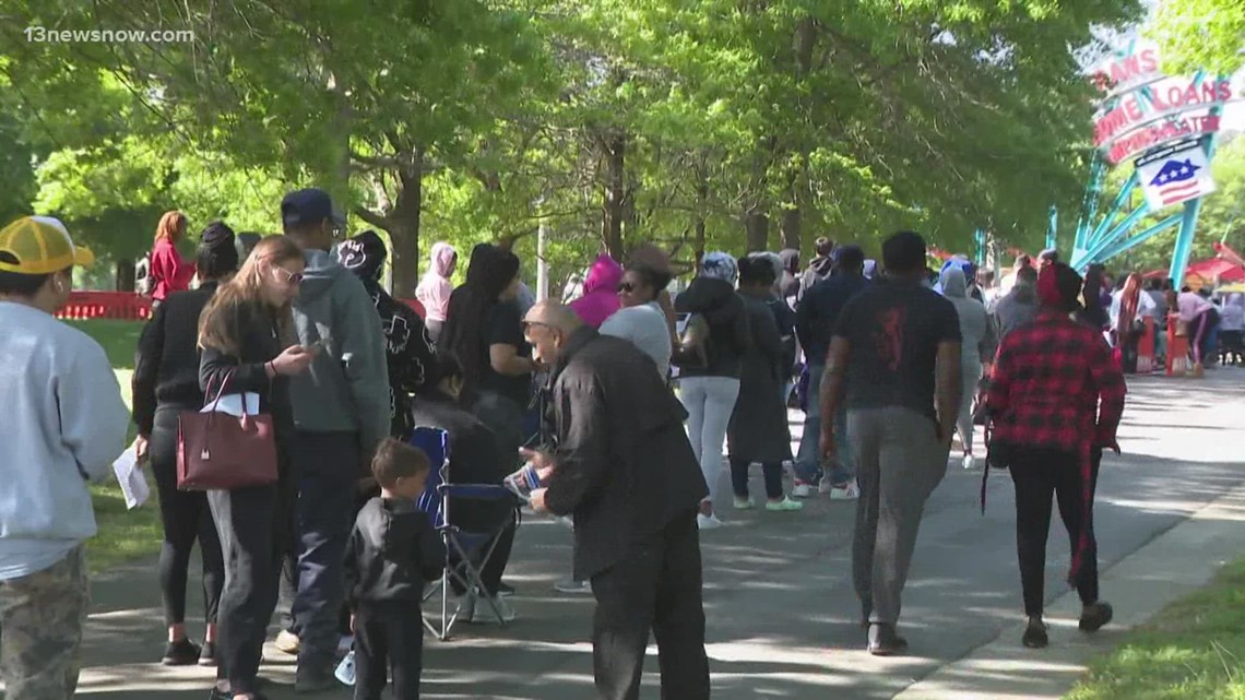 People wait in long lines to get SITW tickets at Veterans United Home ...