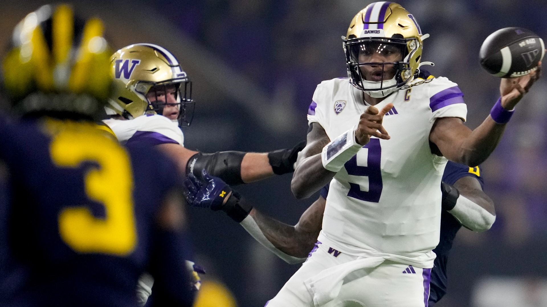 Jim Harbaugh delivers a national title. Corum scores 2 TDs, Michigan overpowers Washington 34-13 ...