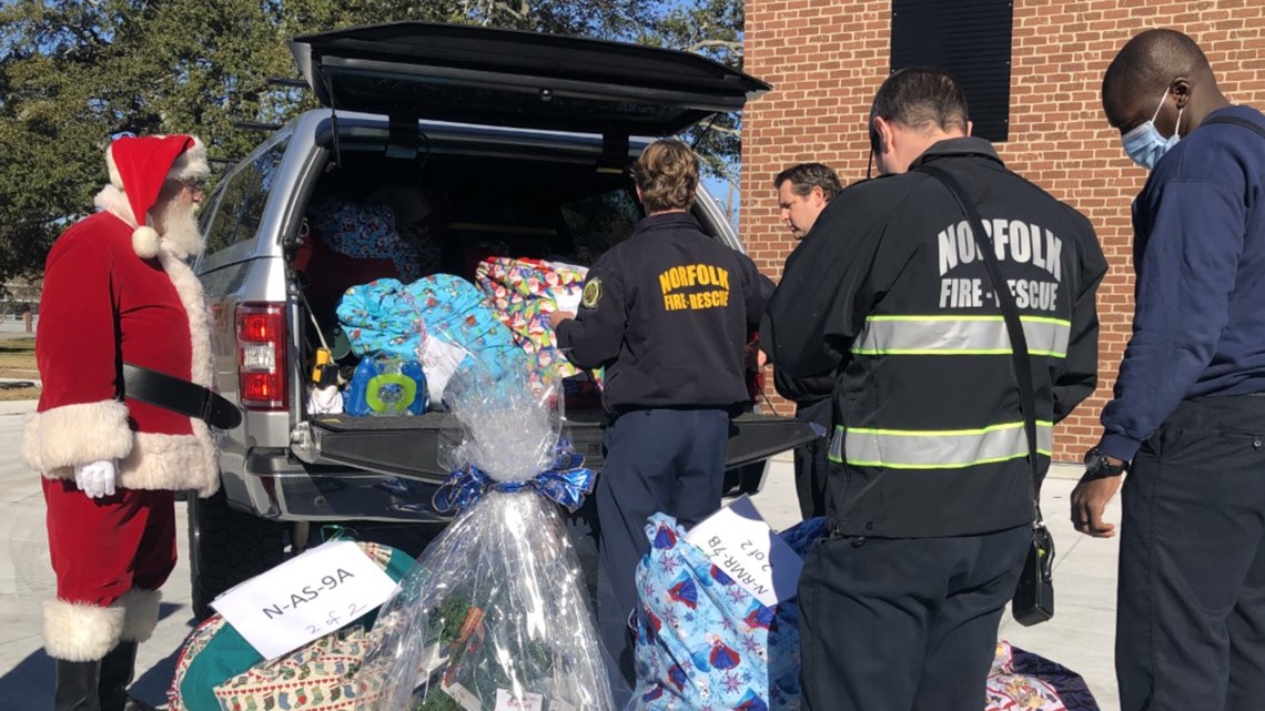 Santa delivers dozens of early Christmas gifts to families with ...