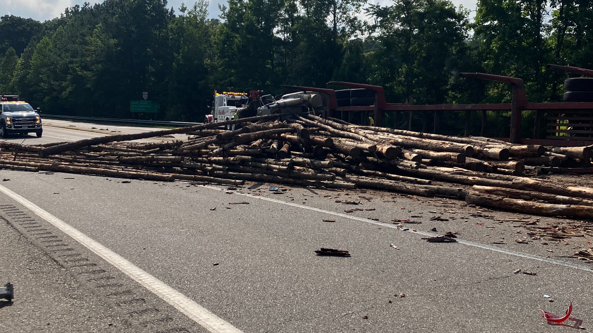 Log truck overturns in Gloucester County, several cars damaged ...