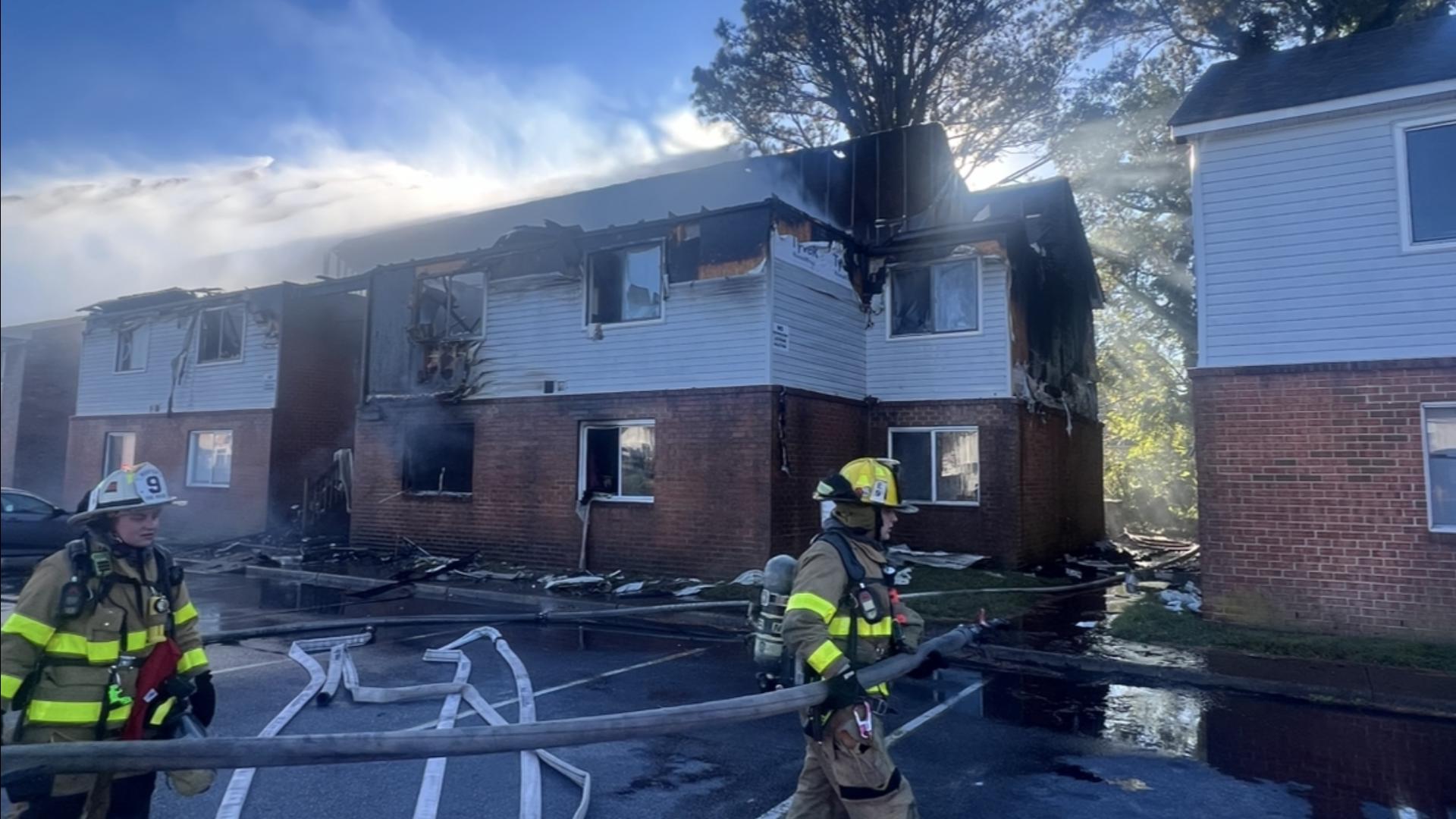 Norfolk firefighters rescue man from large apartment fire, roads closed ...